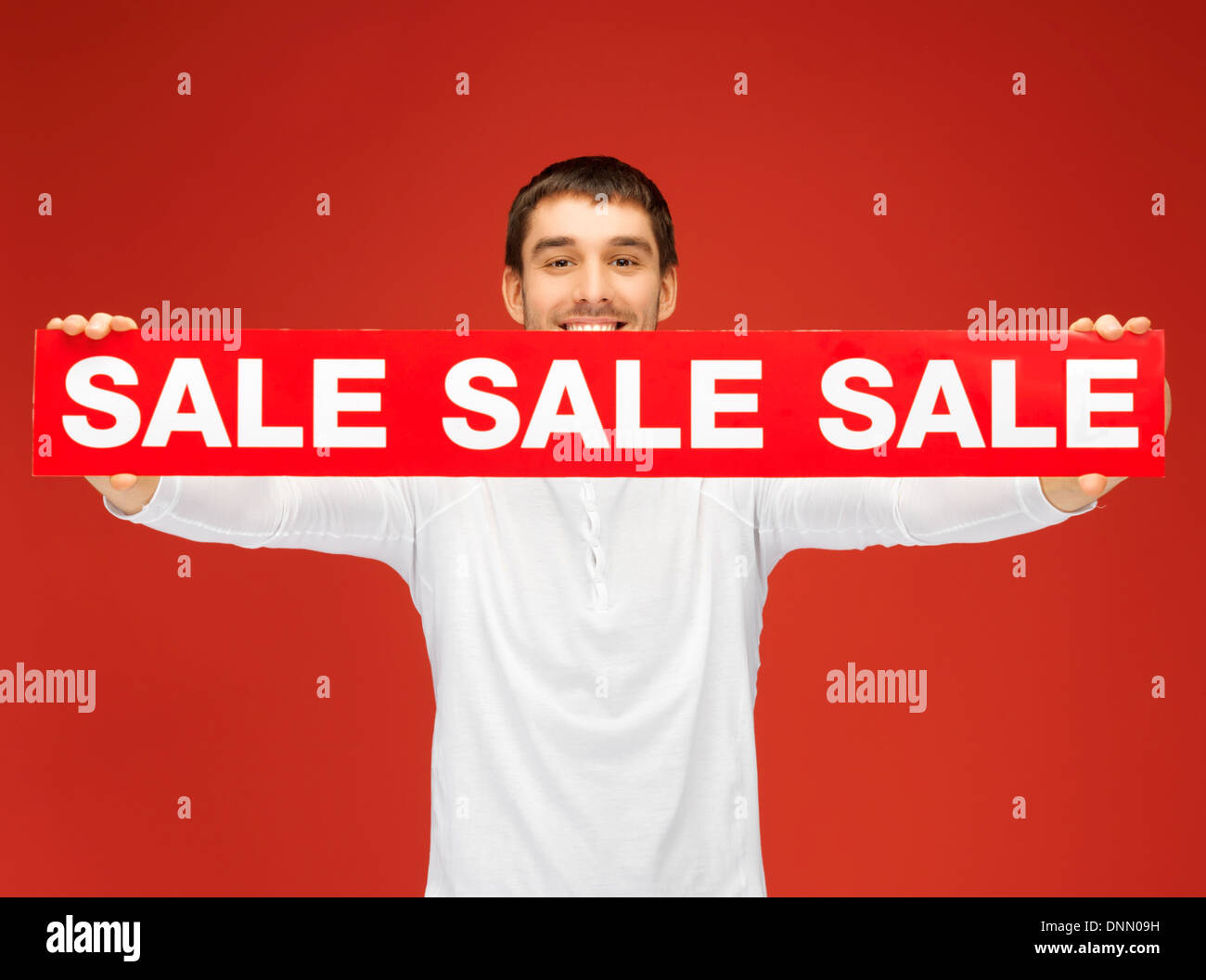 handsome man with sale sign Stock Photo - Alamy