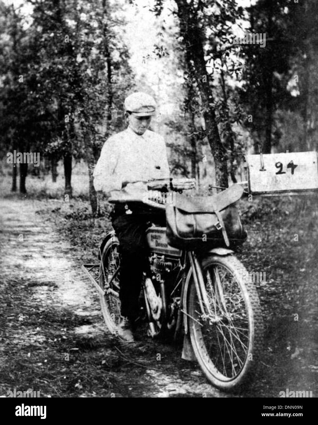 Claude G. Varn, a rural mail carrier, is seen riding a Harley Davidson ...