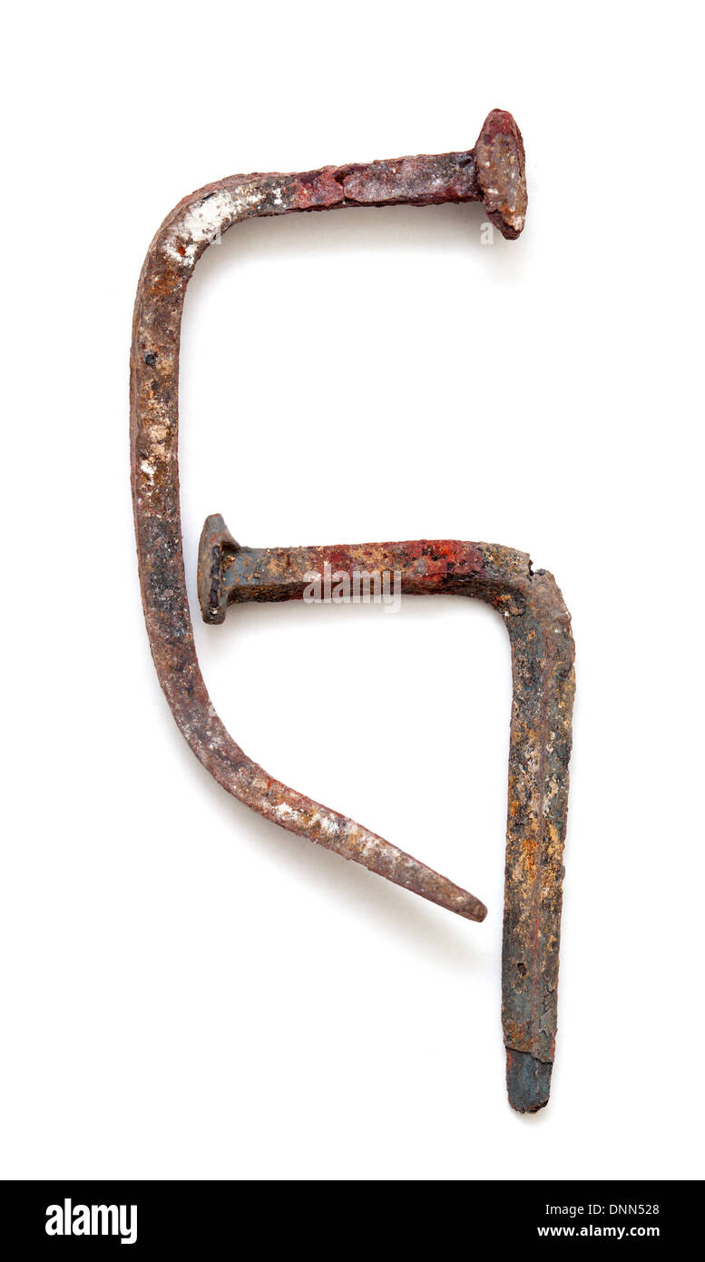 forged nails letters - old rusty bent nails in shape of letters ...