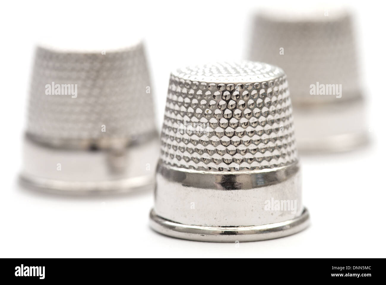 three Thimbles isolated on white Stock Photo - Alamy