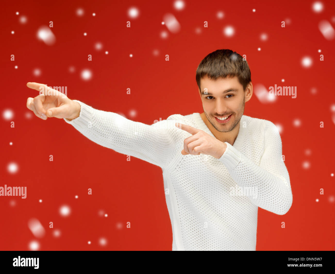 Man in christmas sweater pointing hi-res stock photography and images ...