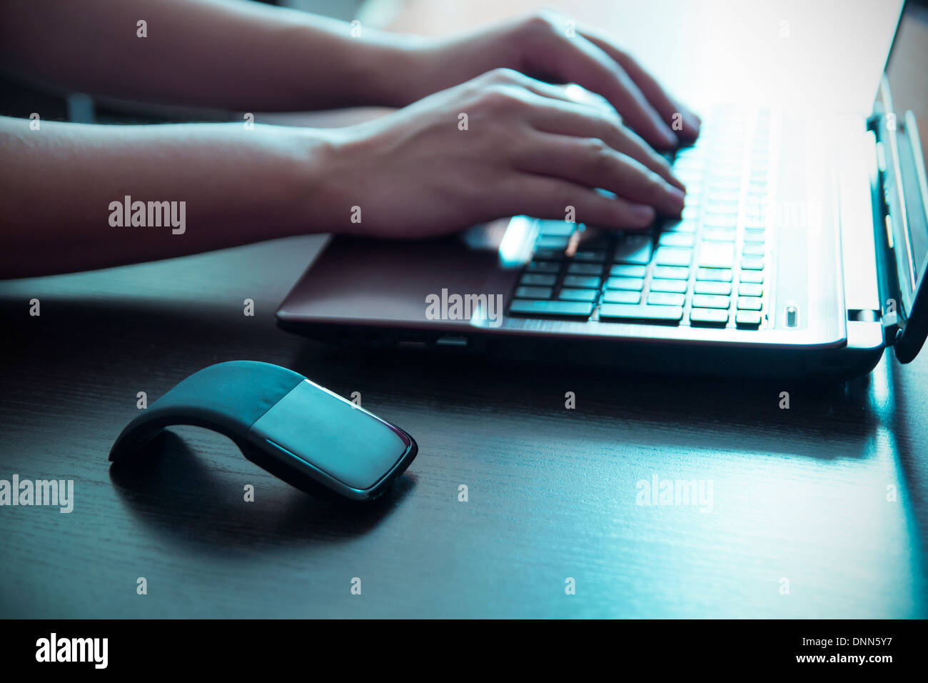 Human hand on computer mouse. Laptop on desk Stock Photo - Alamy