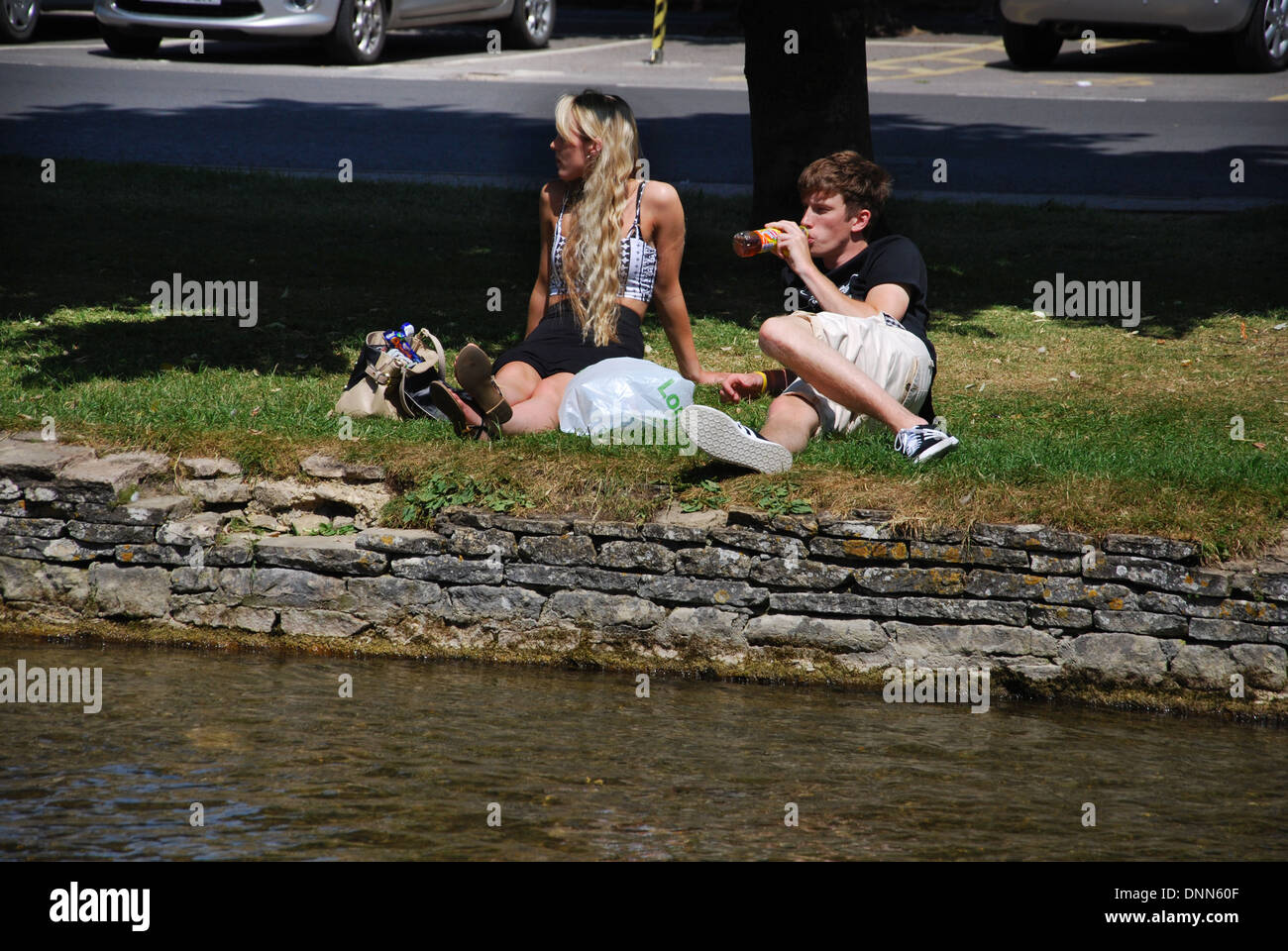 Families sitting by waterside hi-res stock photography and images - Alamy