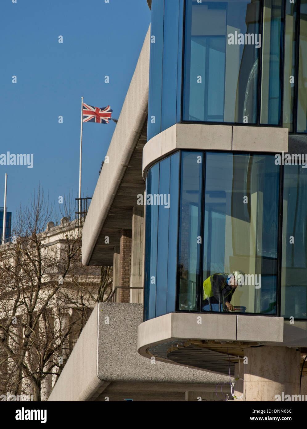 Construction workers putting finishing touches and inspecting luxury ...