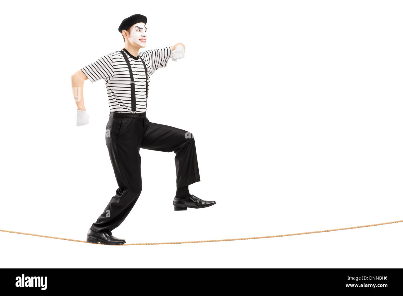 Full length portrait of a male mime artist walking on a rope Stock ...