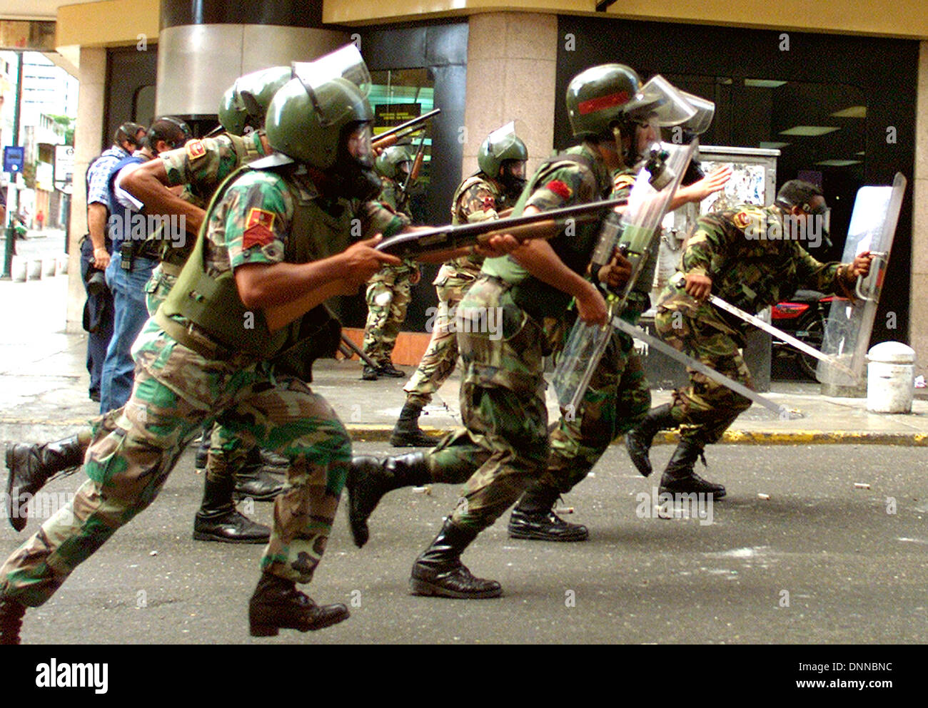 National guard members charge protesters in Caracas, Venezuela ...