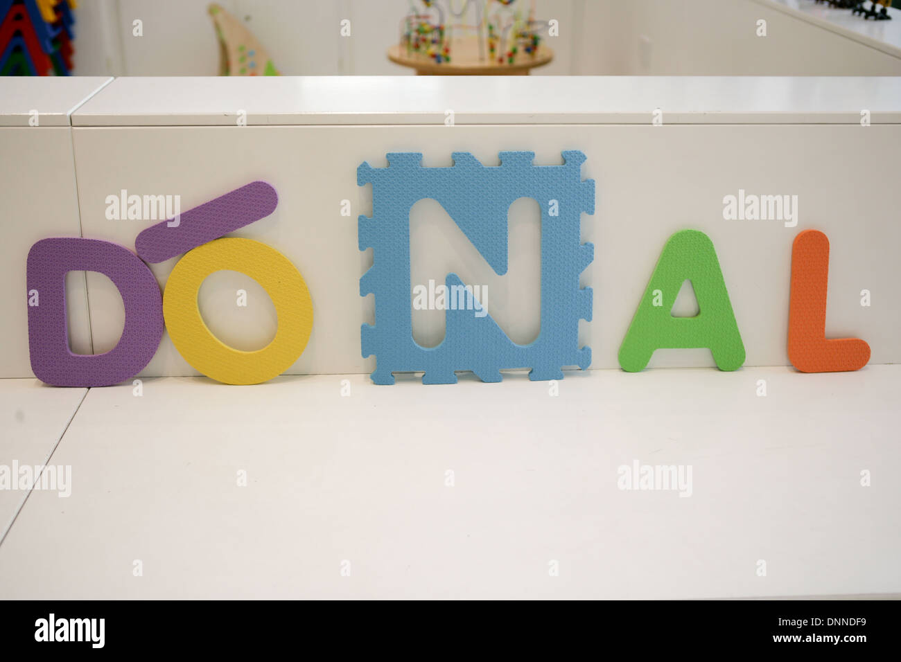 02 January 2014 Belfast, UK Boys' name written in soft floor tiles ...