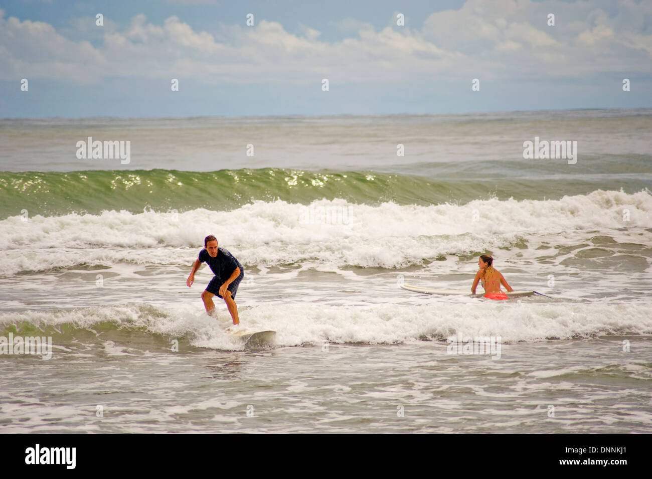 Surfing on the beaches of Dominical, Costa Rica Stock Photo - Alamy