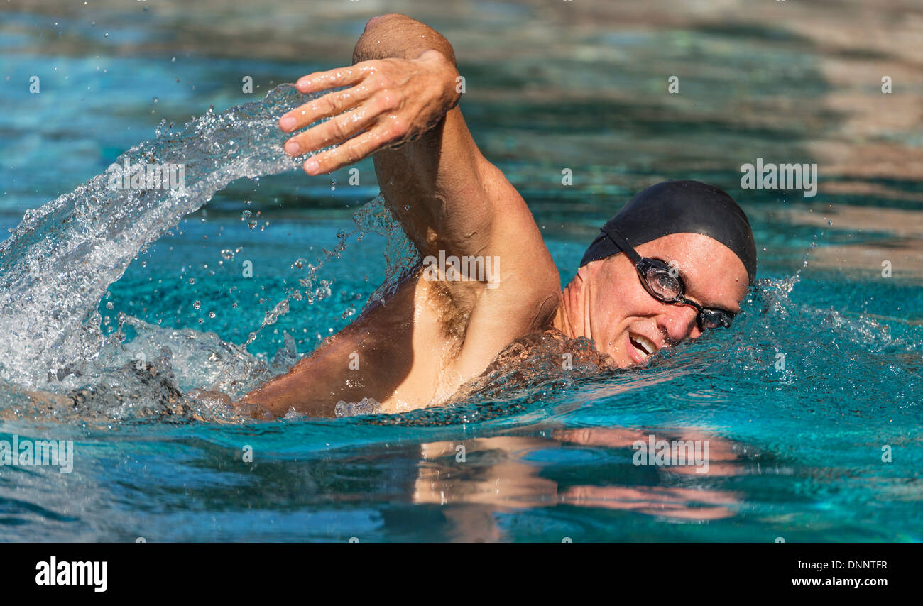 Athletic man swimming Stock Photo - Alamy