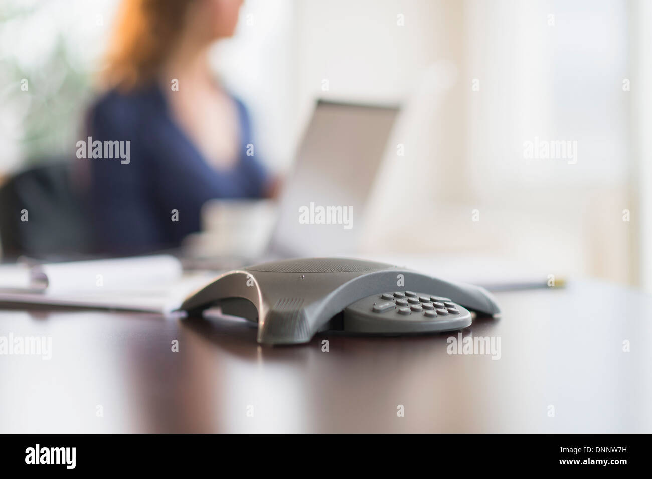 Business phone on office desk Stock Photo - Alamy