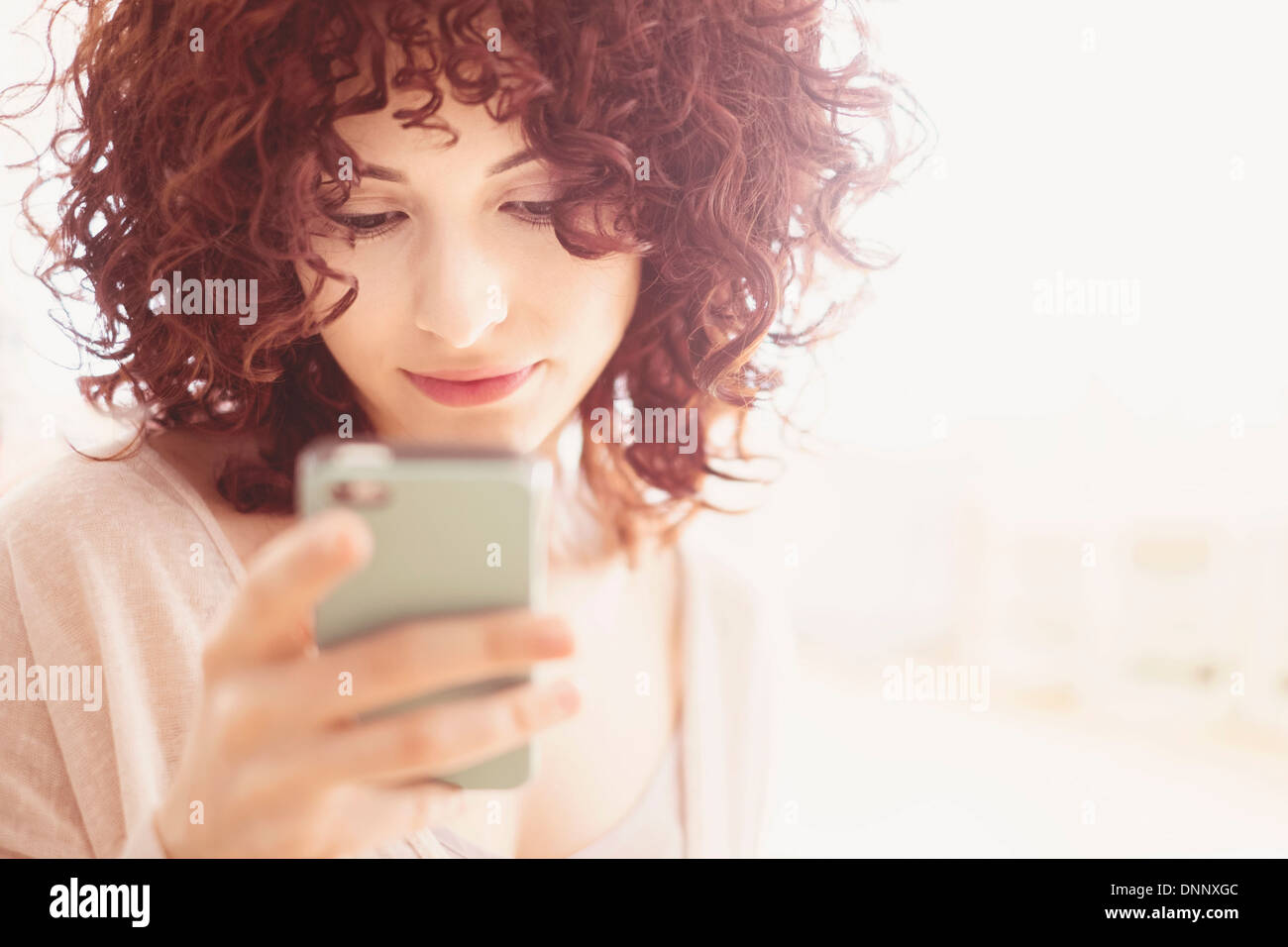 Beautiful brunette woman text messaging Stock Photo - Alamy