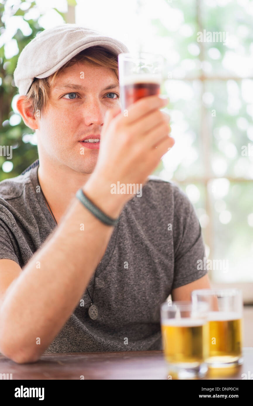 Man examining glass beer hi-res stock photography and images - Alamy