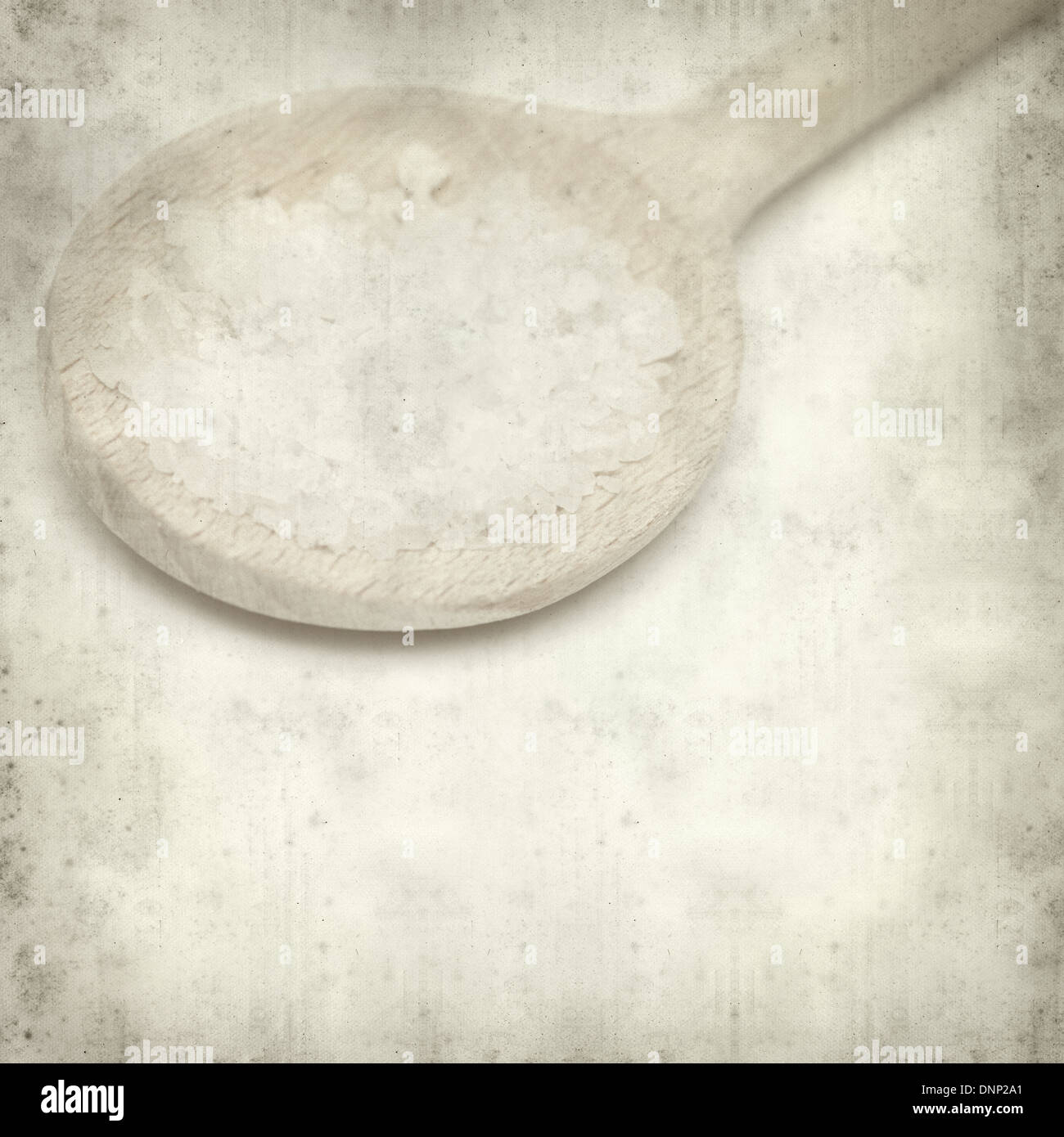 textured old paper background with wooden spoon with rock salt Stock ...