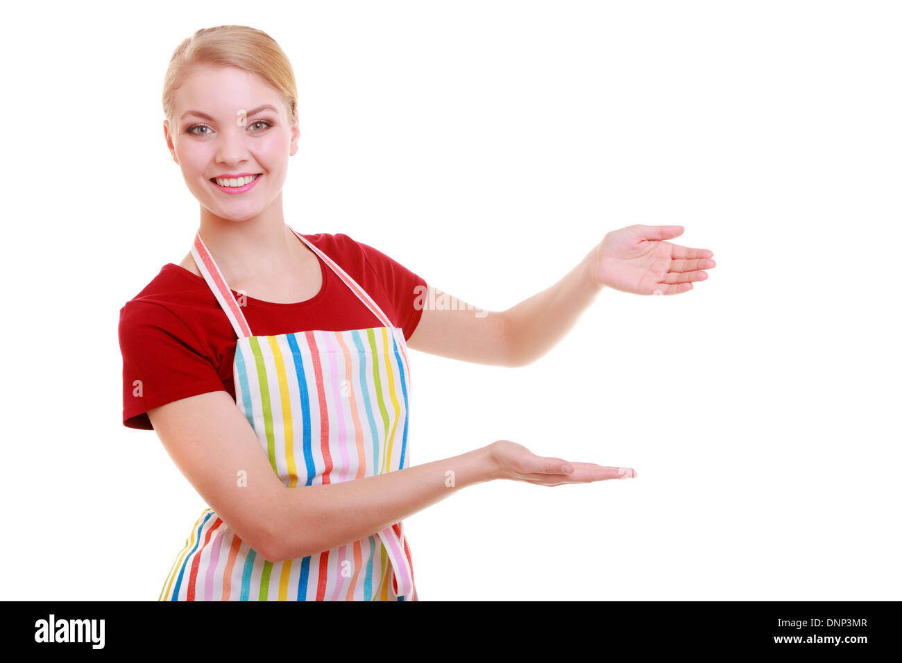 Housewife in colorful kitchen apron inviting making welcome gesture ...