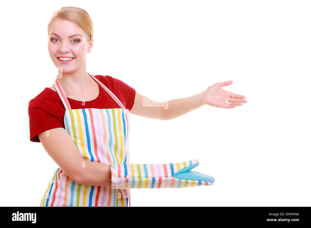 Housewife in colorful kitchen apron inviting making welcome gesture ...