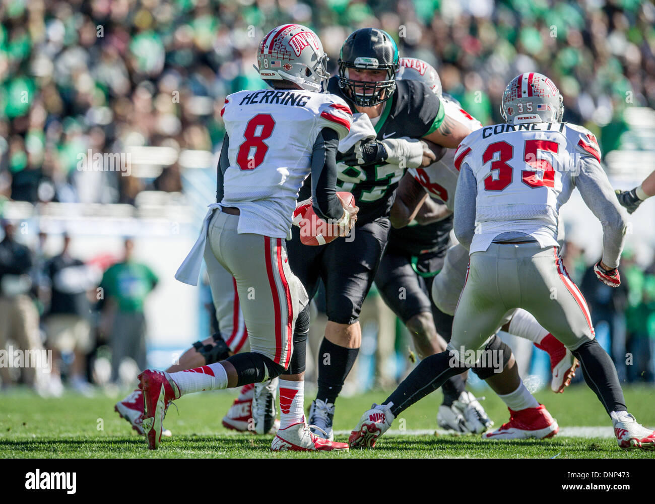 Dallas, Texas, USA. January 1st, 2014: .UNLV Rebels quarterback Caleb ...
