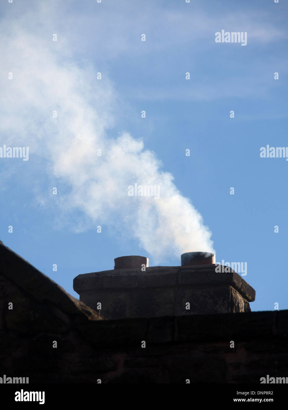 chimney smoke house fire domestic Stock Photo - Alamy