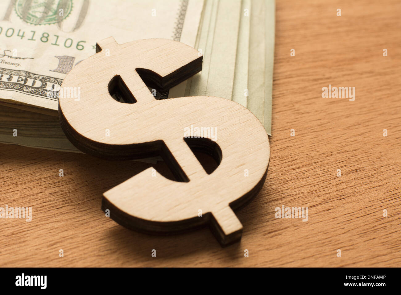 Dollar sign and cash Stock Photo - Alamy