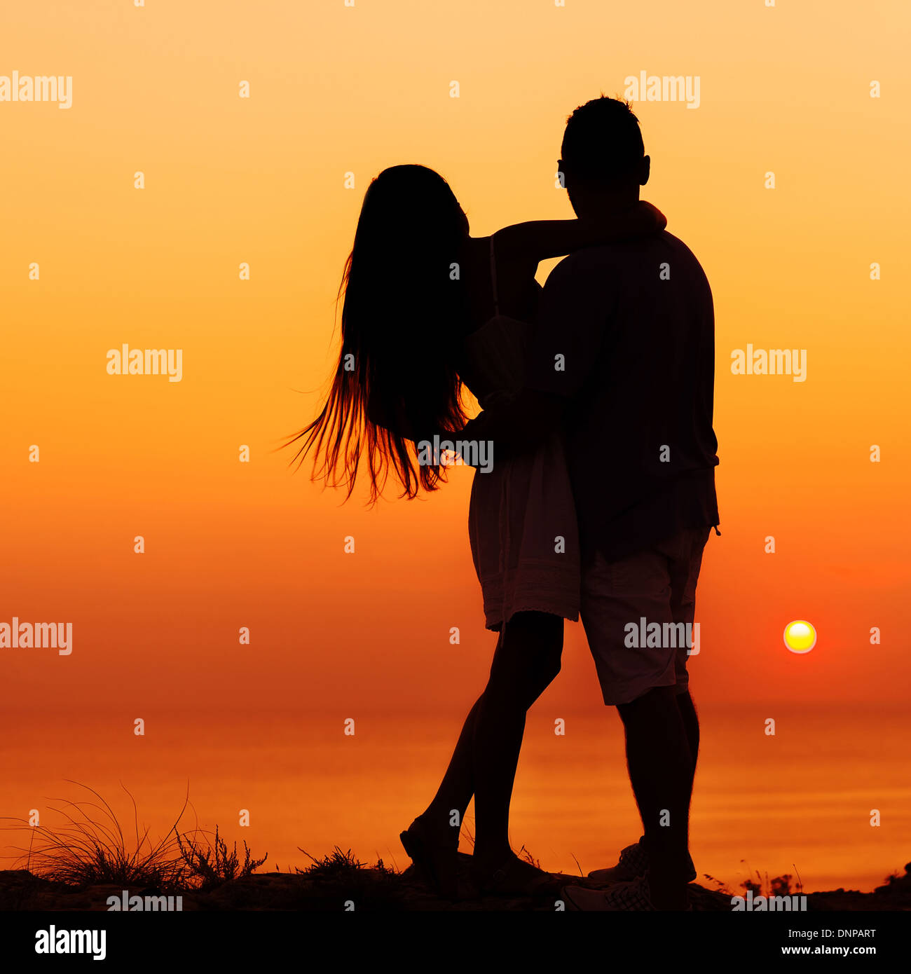 The image of two people in love at sunset Stock Photo - Alamy