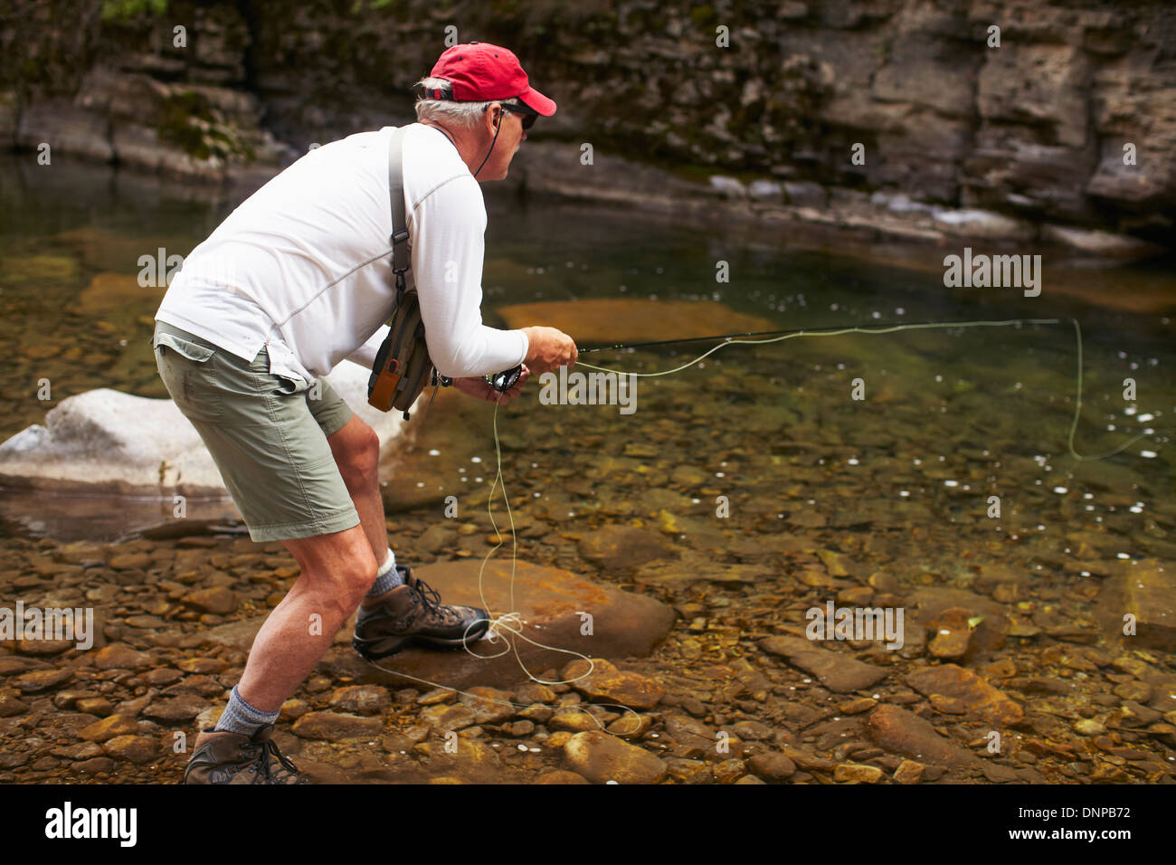 USA, Colorado, Fisherman on riverbank Stock Photo - Alamy