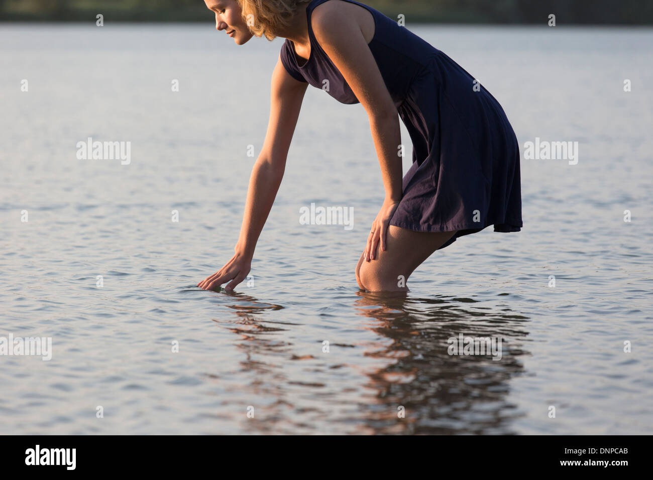 Beautiful woman in lake Stock Photo - Alamy