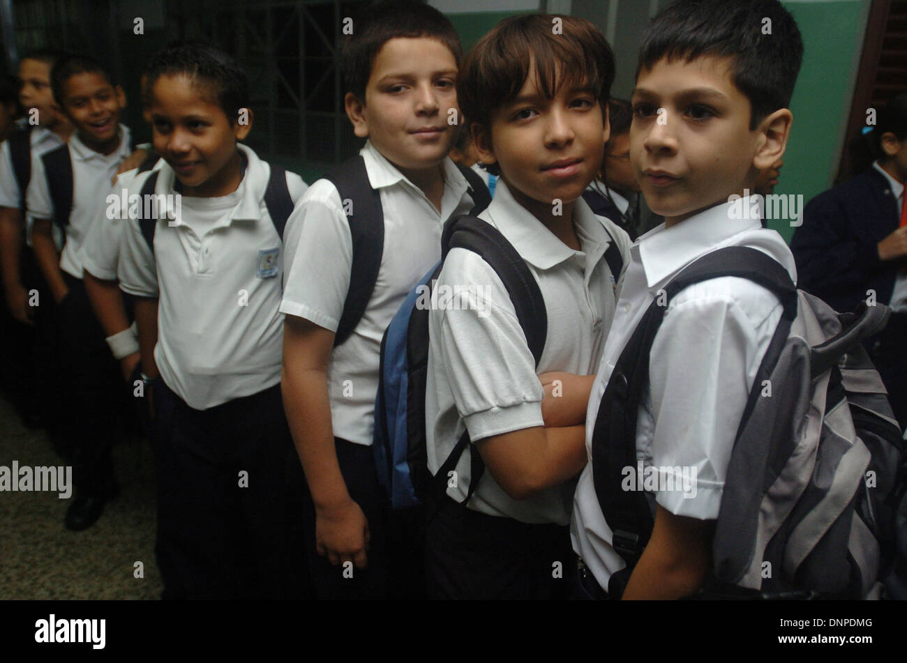 Children wait in line to enter their school in Caracas, Venezuela ...
