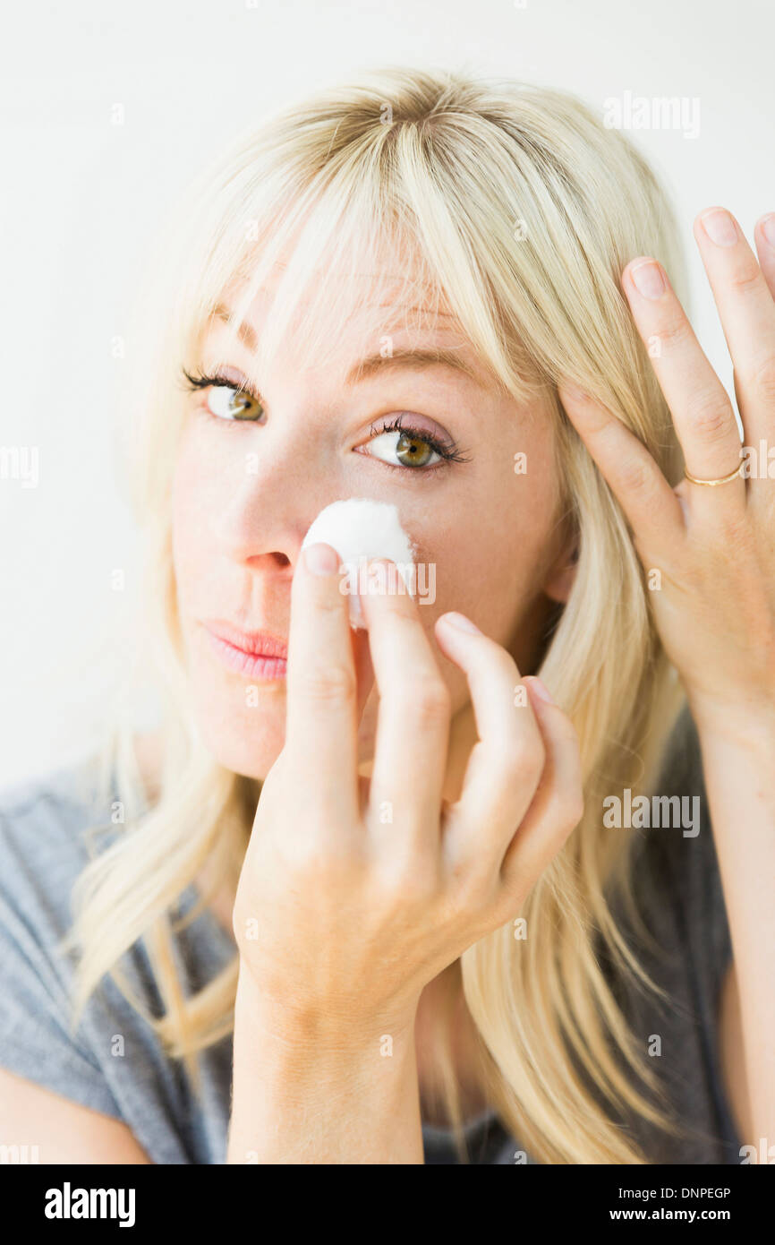 Woman cleaning face Stock Photo - Alamy