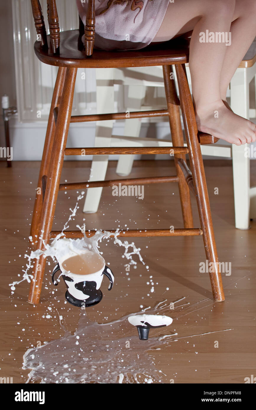 child dropping milk bottle Stock Photo - Alamy