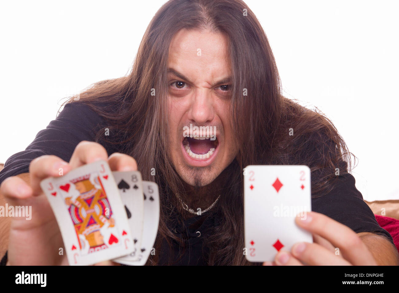 angry man shows his cards in game Stock Photo - Alamy