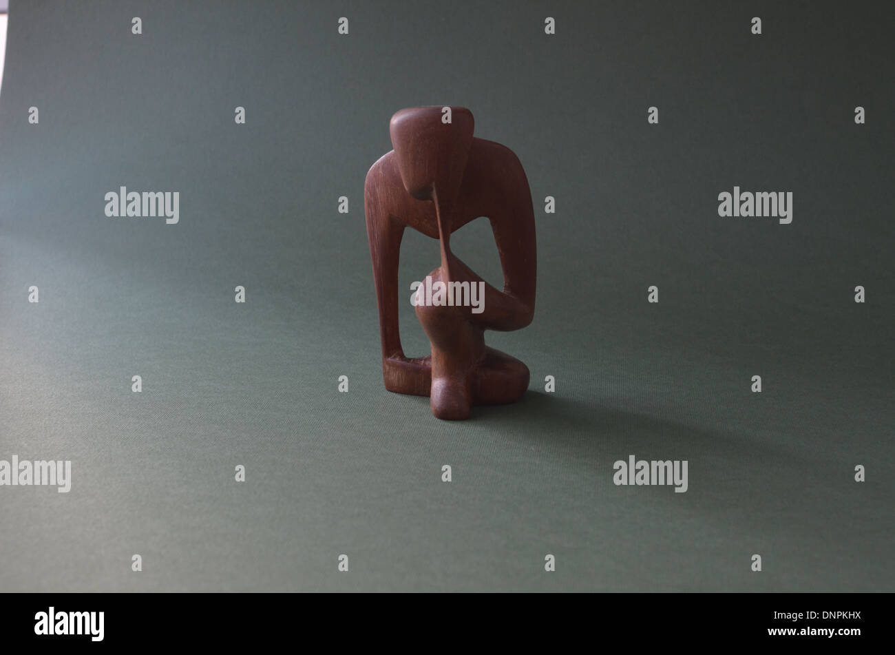Sculpture. thinking man wood Stock Photo - Alamy