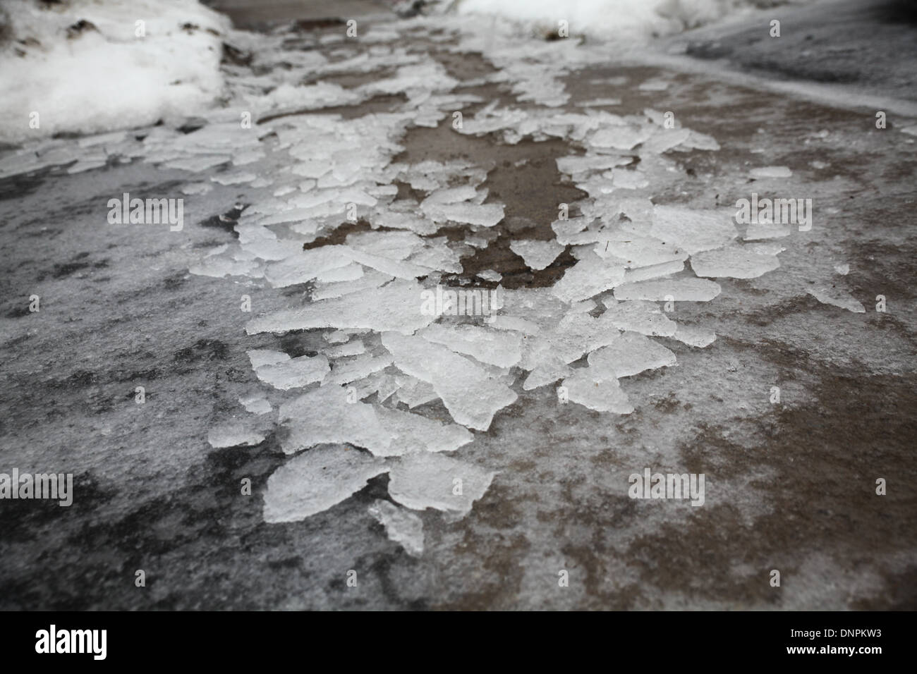 Scattered ice on the road Stock Photo - Alamy