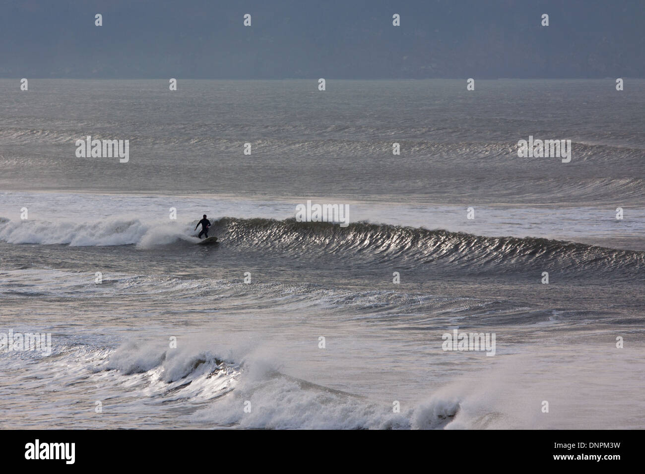 Surfing at Woolacombe Bay in North Devon. This stretch of the UK ...