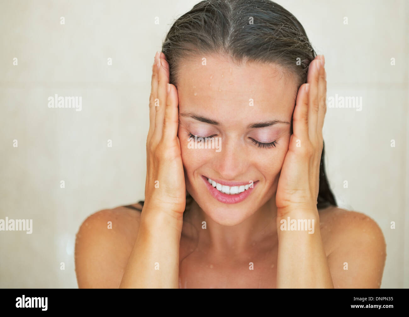 Happy young woman in shower Stock Photo - Alamy