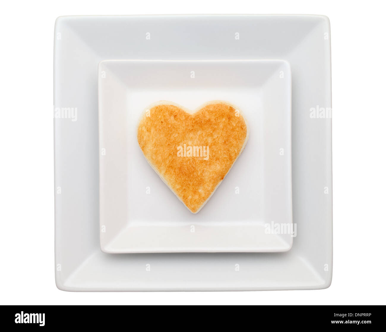 toasted slice of bread with heart shape on plate Stock Photo - Alamy