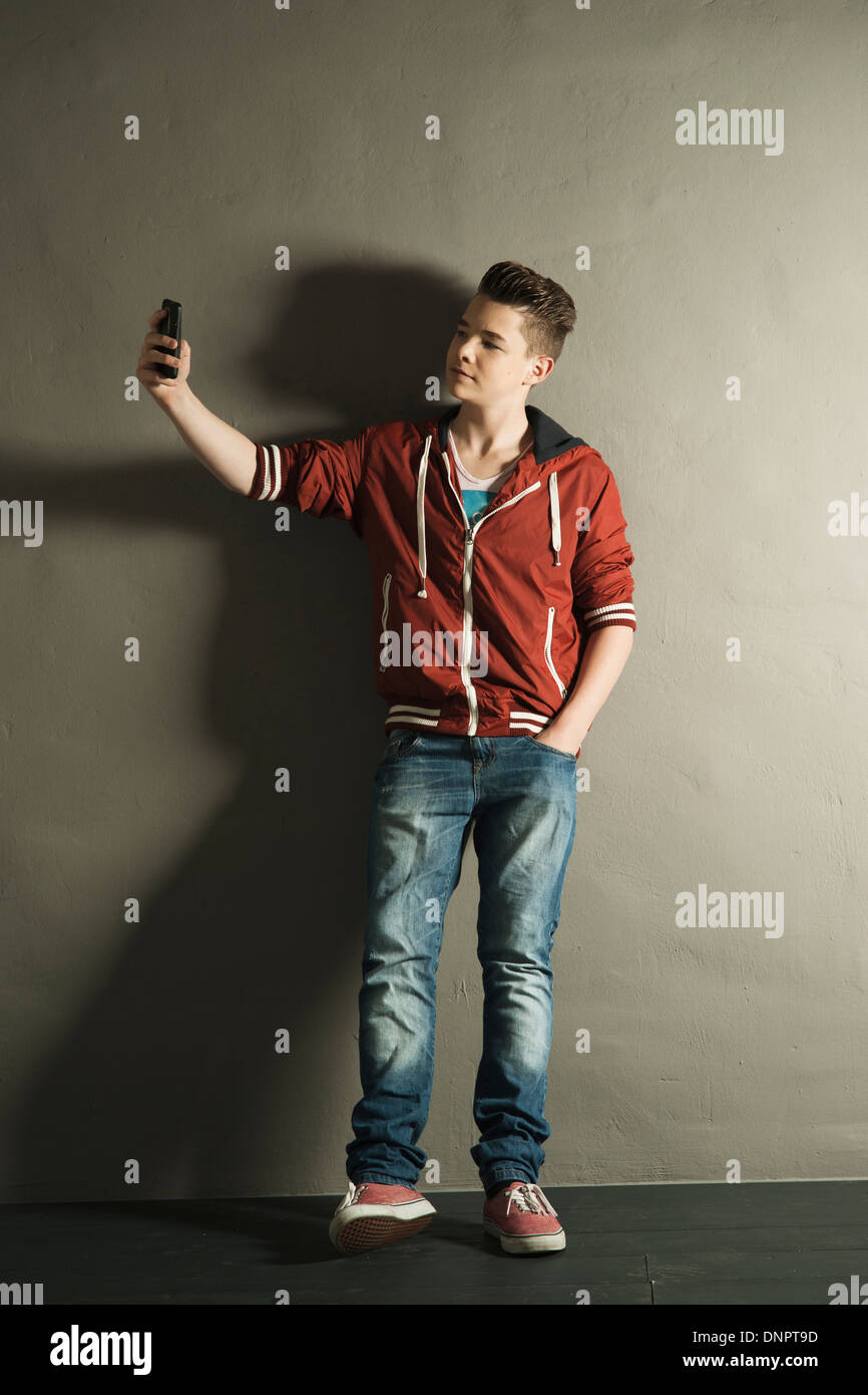 Teenage boy taking a photograph hi-res stock photography and images - Alamy