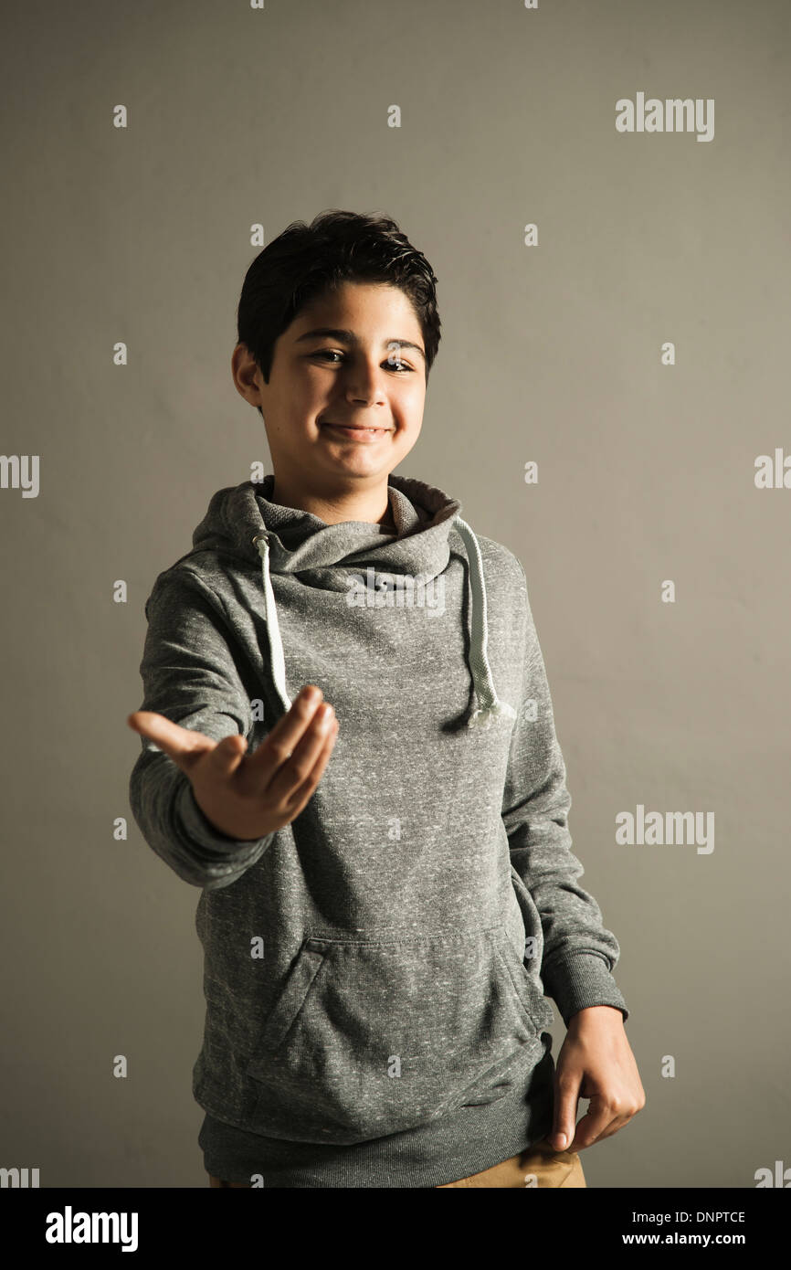 Portrait of Teenage Boy with Hand out, Studio Shot Stock Photo - Alamy