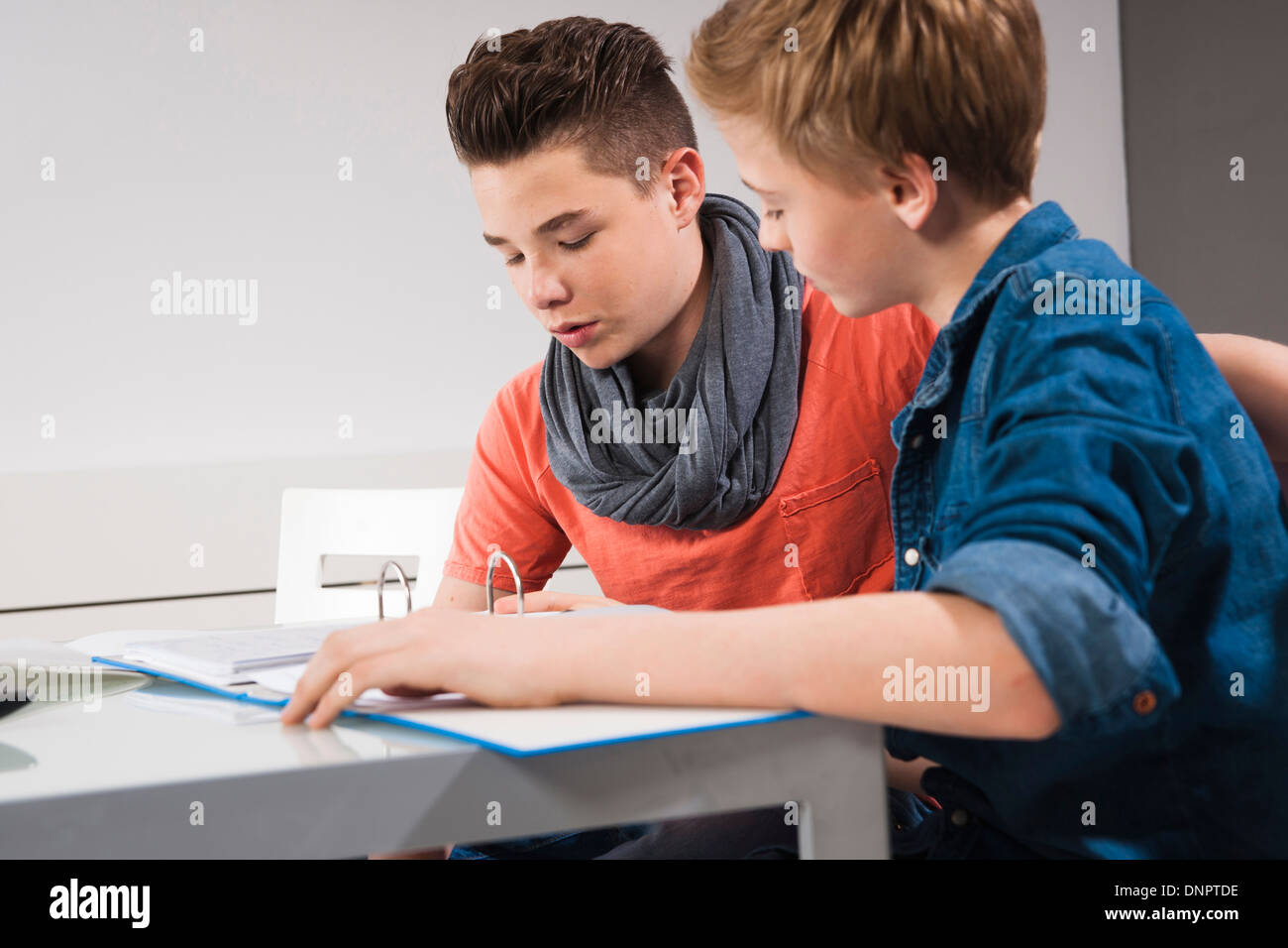 Teenage Boys Studying Together, Studio Shot Stock Photo - Alamy