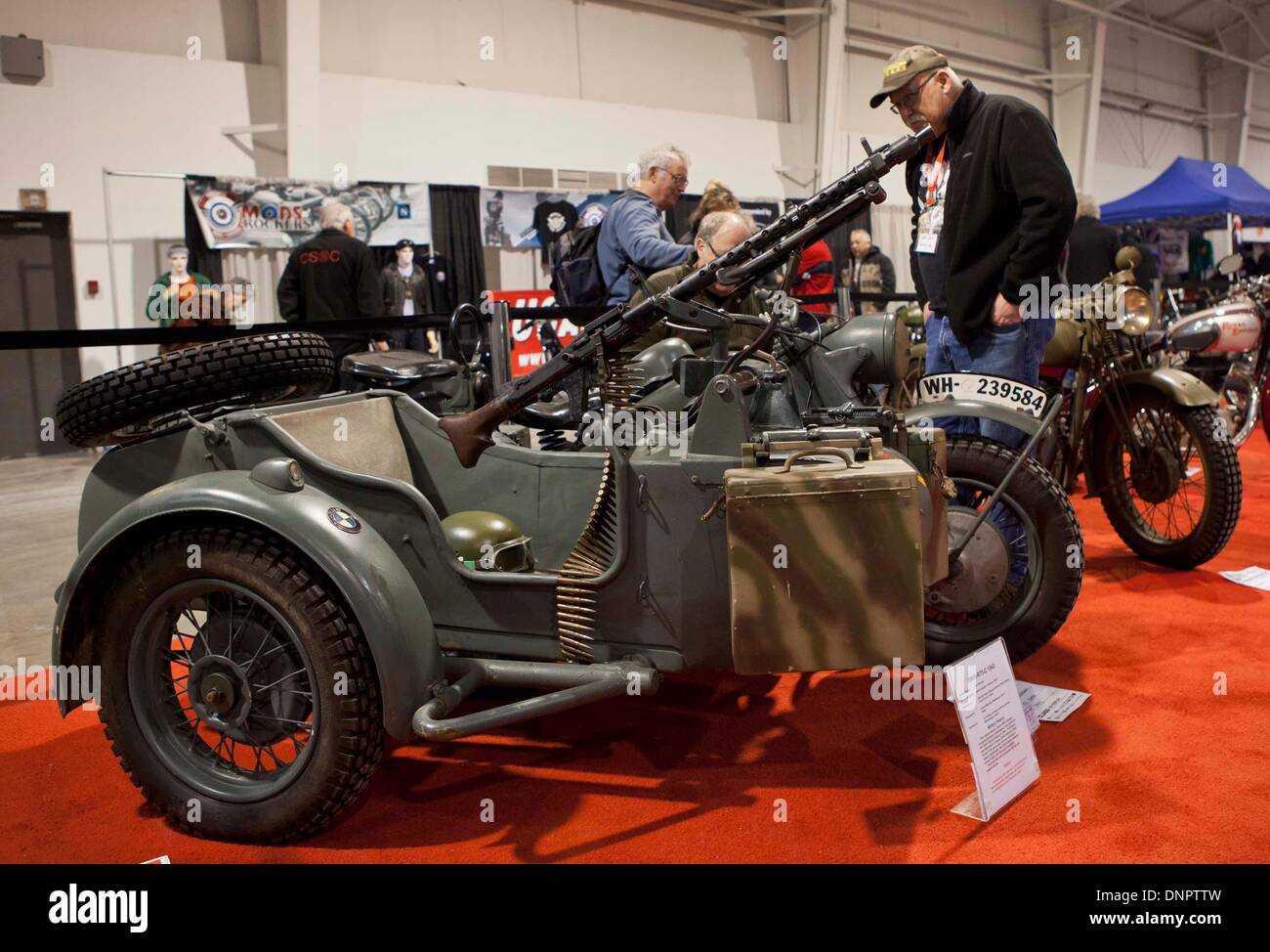 Toronto, Canada. 3rd Jan, 2014. Visitors look at a motorcycle made in ...