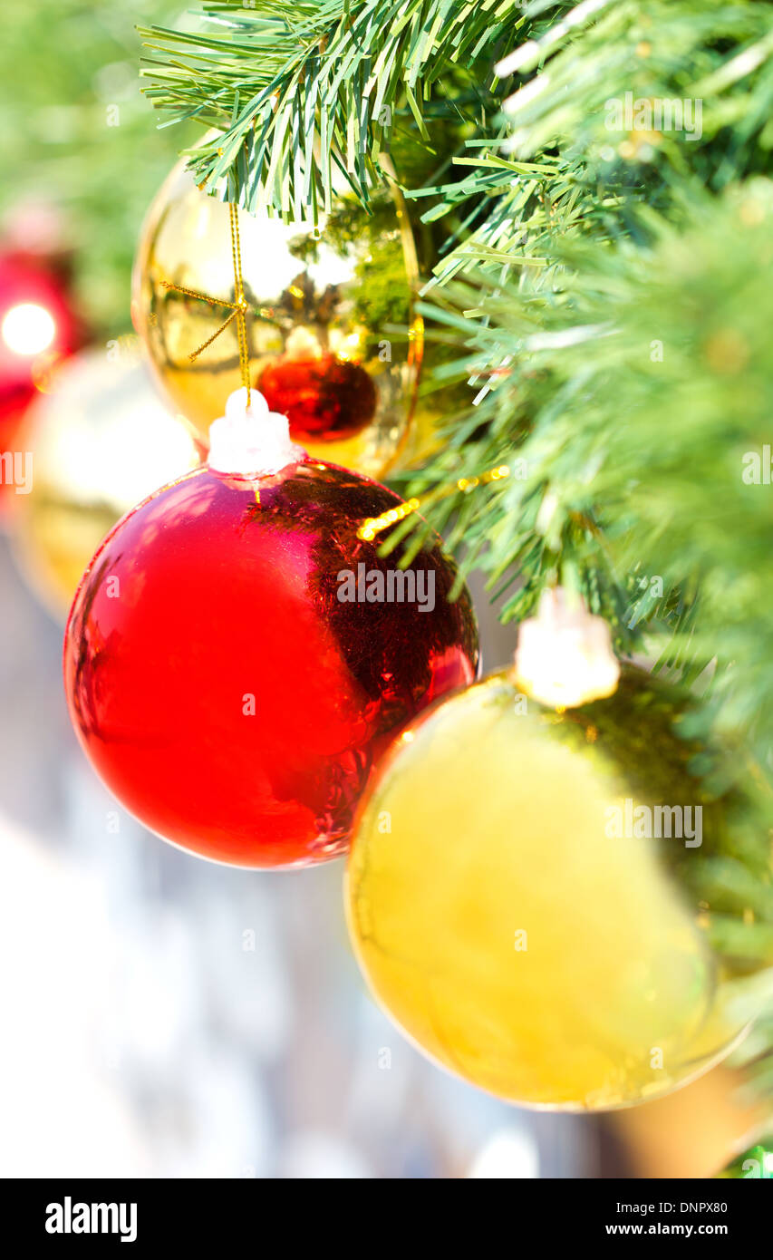 Christmas balls decorated on fake pine tree Stock Photo - Alamy