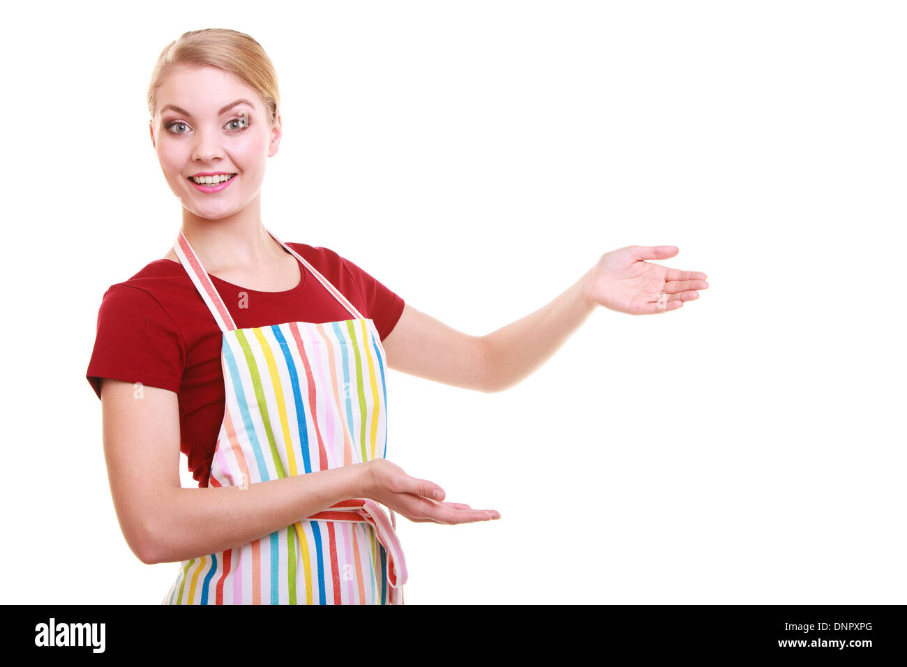 Housewife in colorful kitchen apron inviting making welcome gesture ...