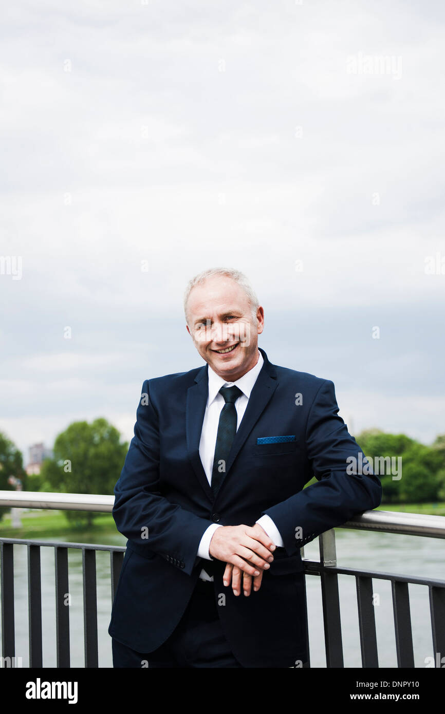 Man leaning on bridge railing hi-res stock photography and images - Alamy