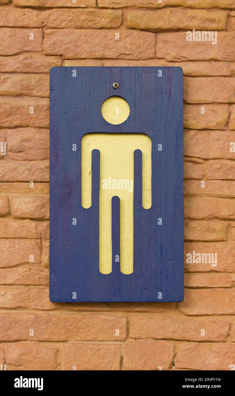 Male toilet sign on the brick wall Stock Photo - Alamy