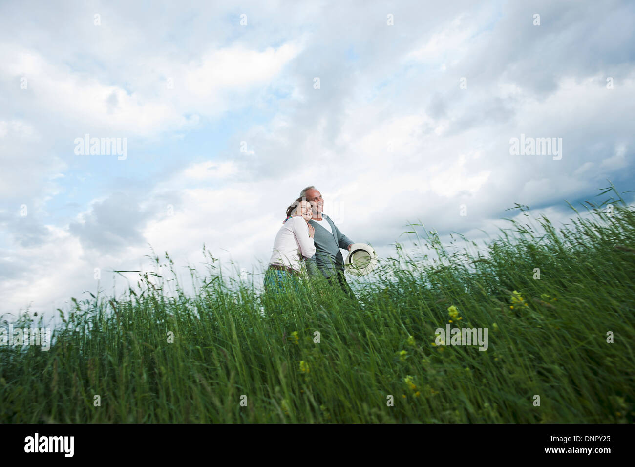 Woman walking in field open hi-res stock photography and images - Alamy