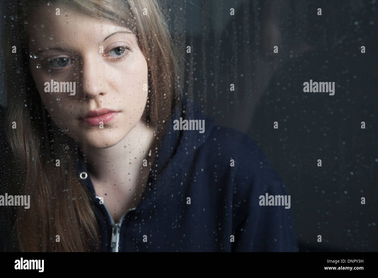 Woman behind wet window hi-res stock photography and images - Alamy