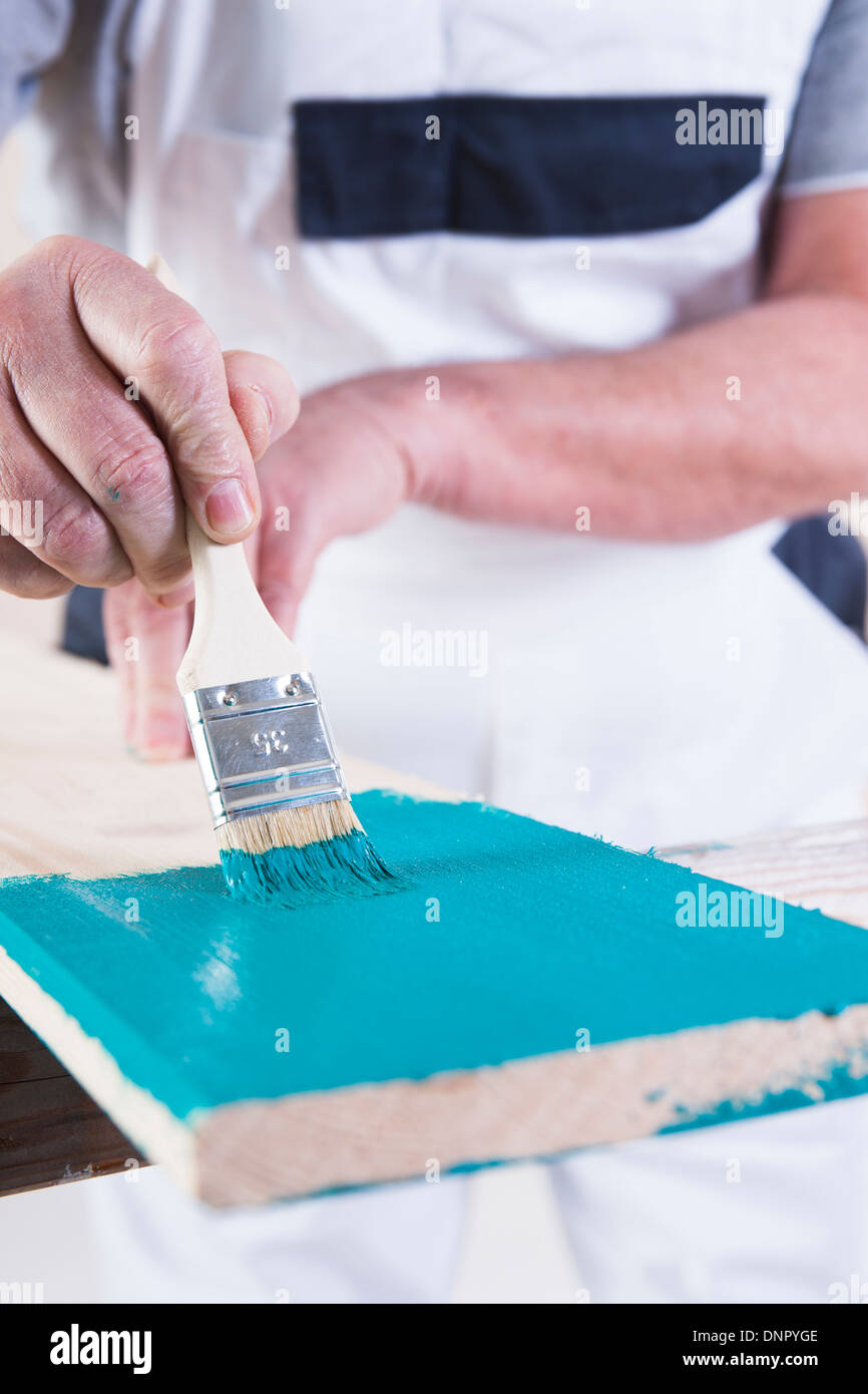 Blue overalls painting hi-res stock photography and images - Alamy