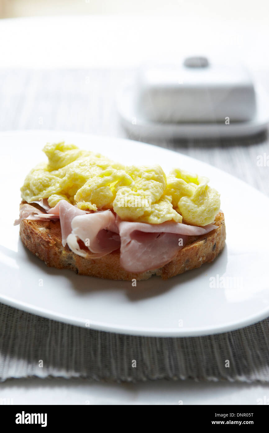 Multigrain Toast with Scrambled Eggs and Ham, Studio Shot Stock Photo ...
