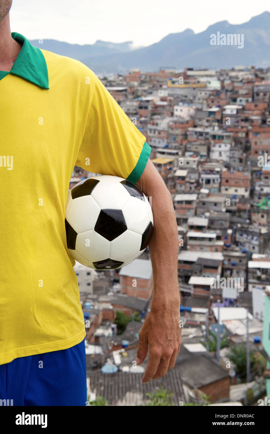 Brazilian football player standing in uniform holding soccer ball in ...