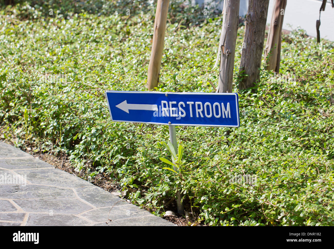 Restroom text sign at the park Stock Photo - Alamy
