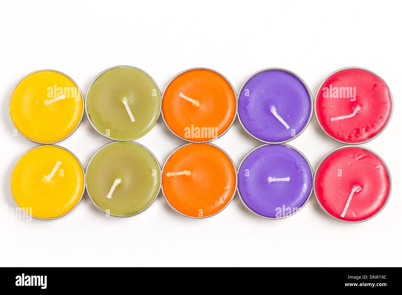 Colorful spa candles isolated on white Stock Photo - Alamy