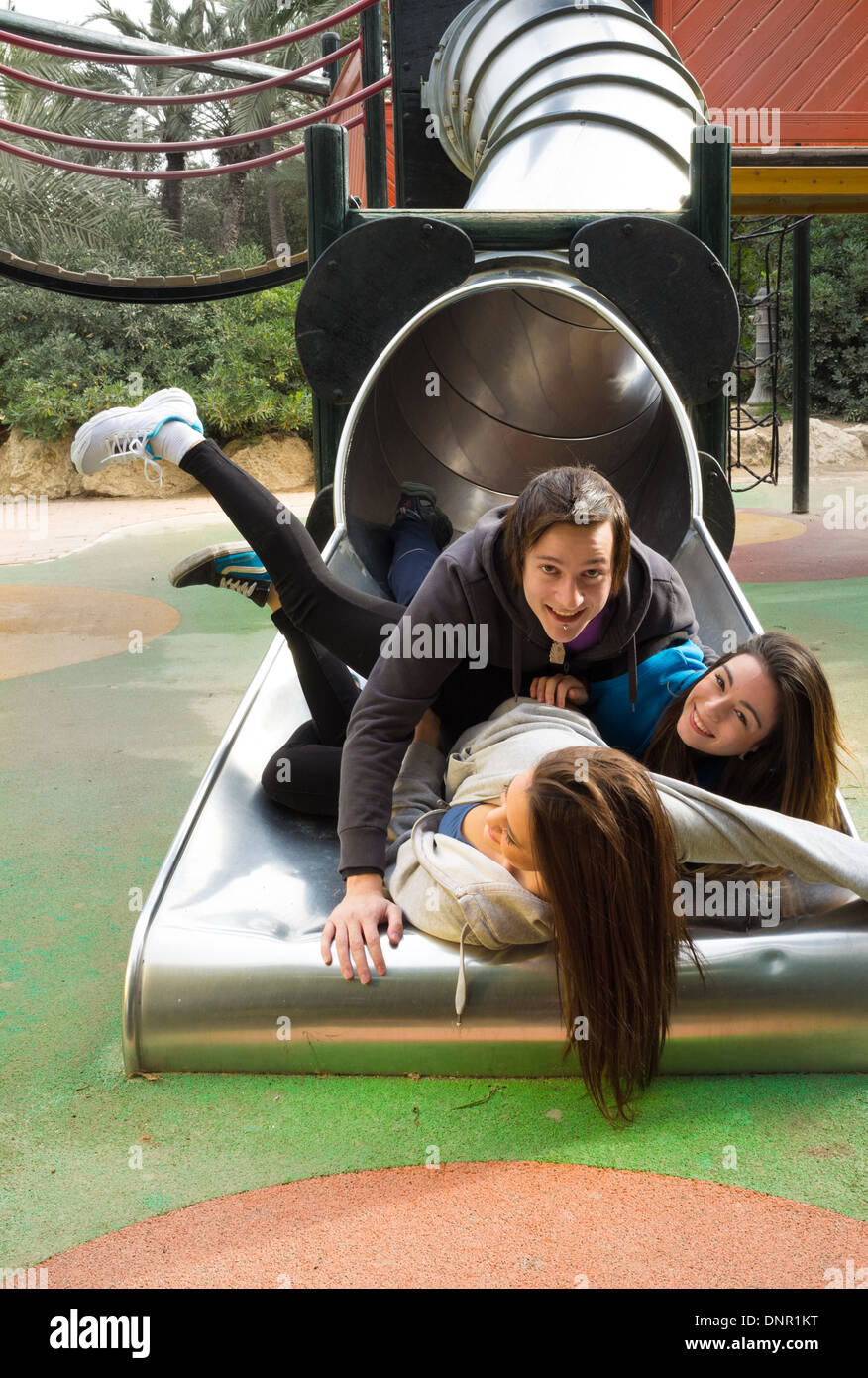 Friends fooling around in a public park having lots of fun Stock Photo ...